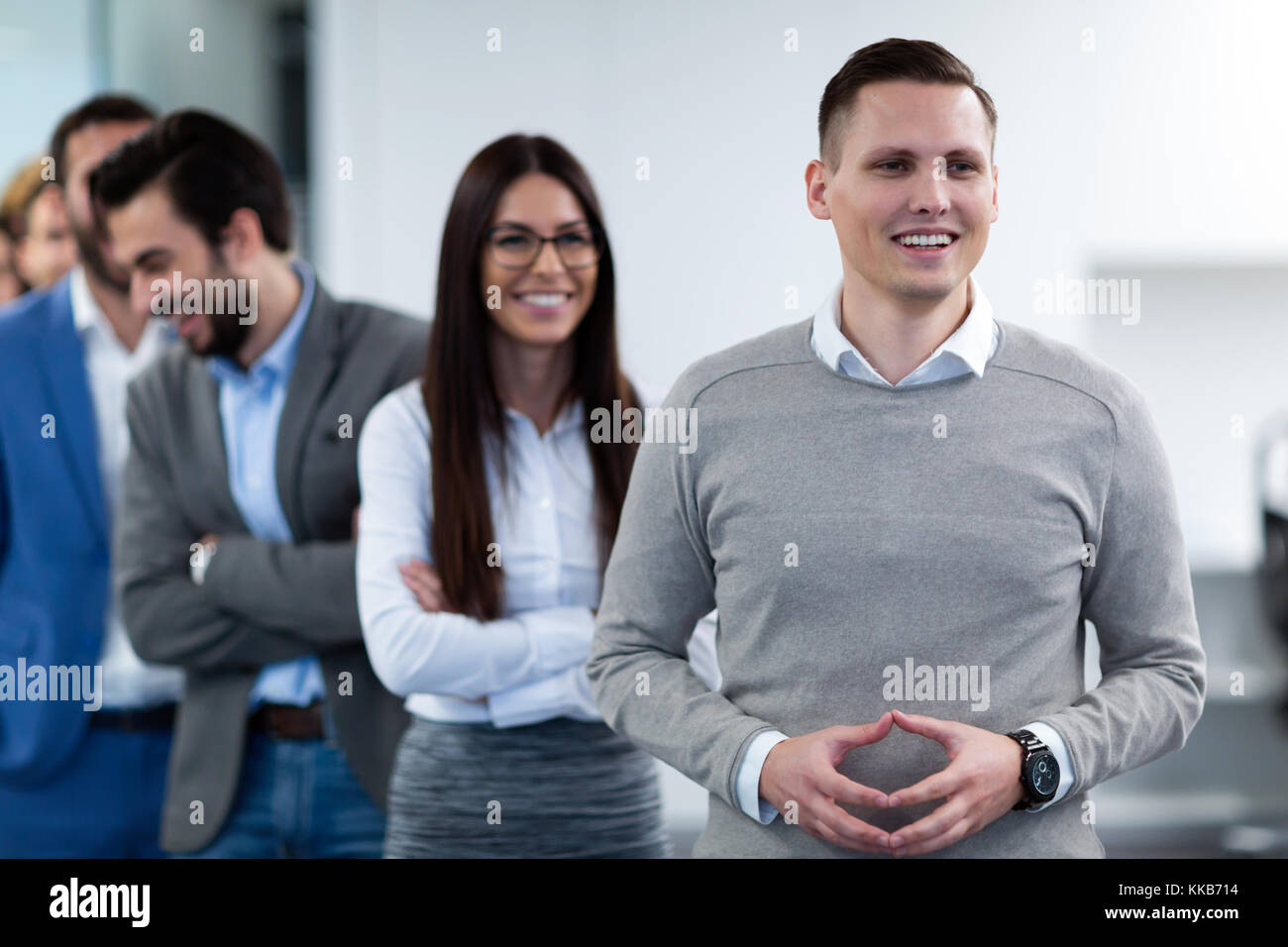 Group picture of business team posing in office Stock Photo - Alamy