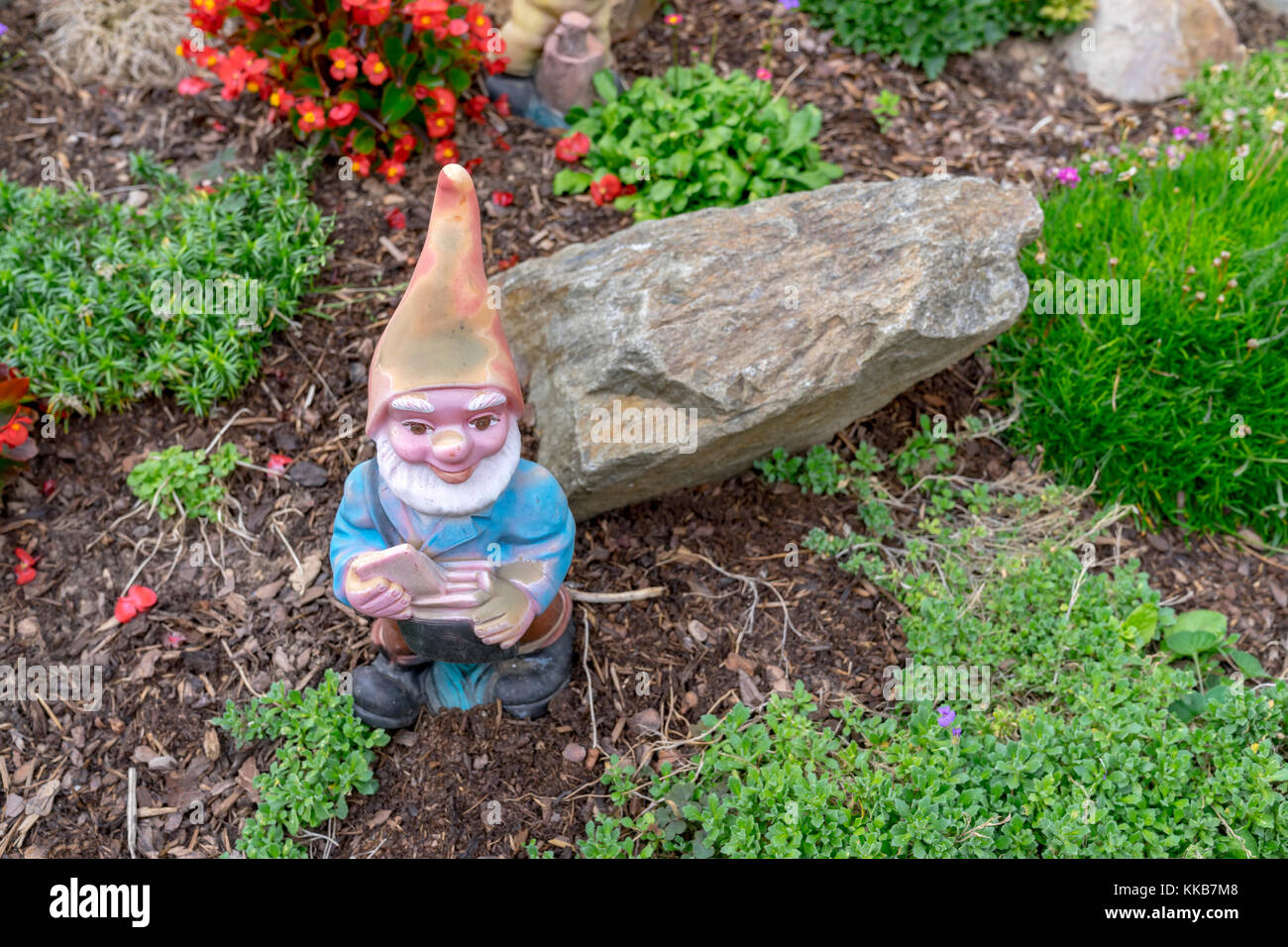 Faded garden dwarfs in a German front yard Stock Photo - Alamy