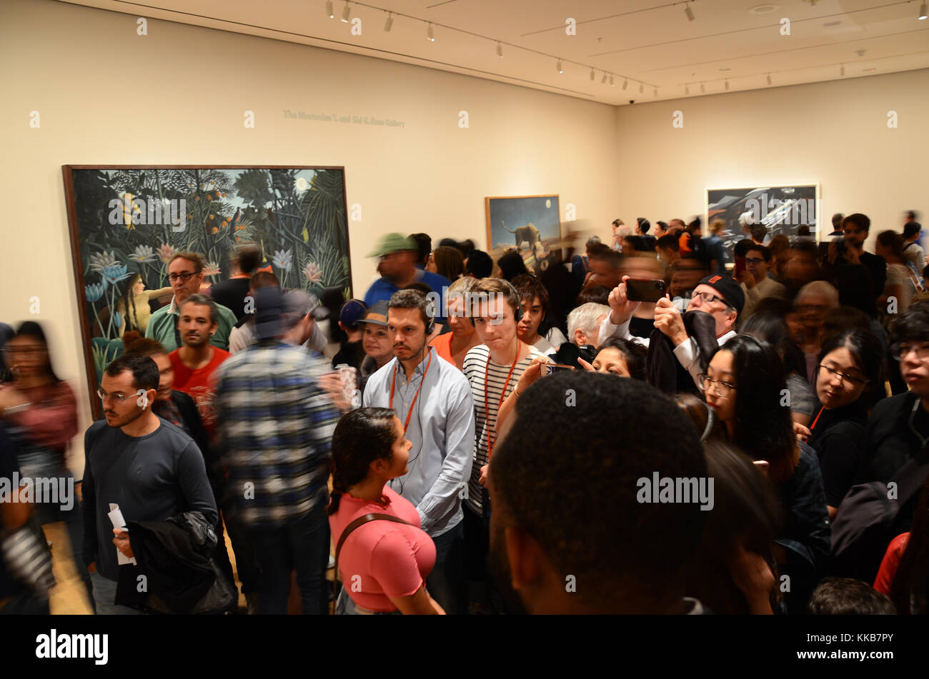 Crowds in a busy gallery at MoMA New York City Stock Photo - Alamy