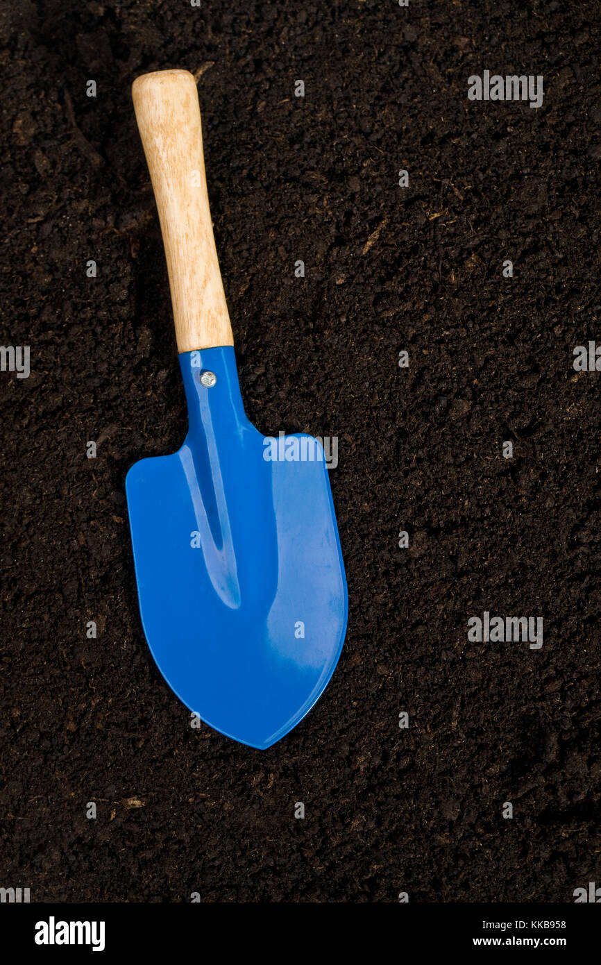 shovel in soil for flower and seedingses background Stock Photo - Alamy