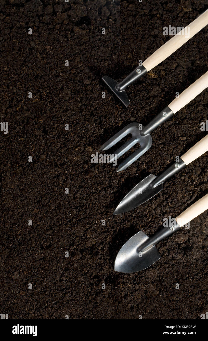 gardening tools and peat on background Stock Photo - Alamy