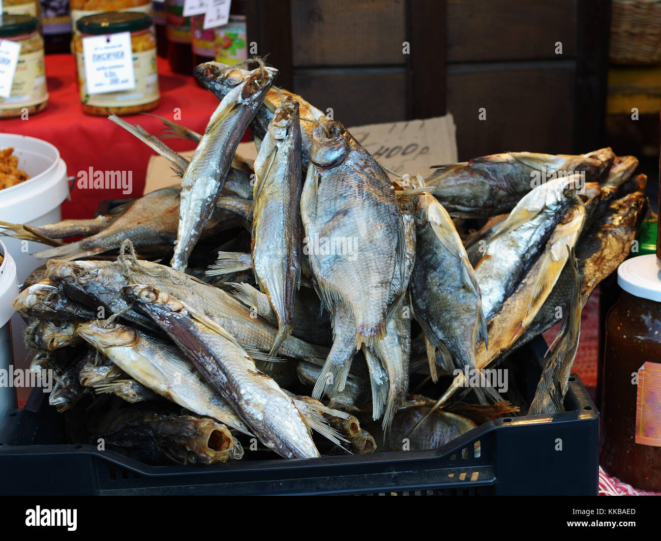 The dried fish strung on a string and lying on the counter in the sale ...
