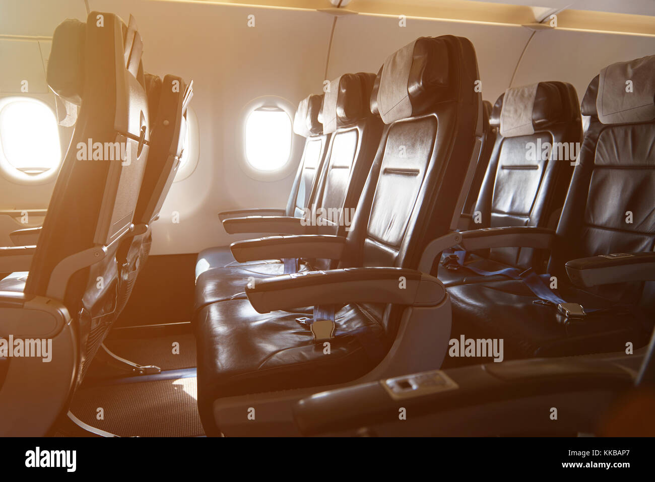 Empty cabin of airplane with leather clean seats. Nobody inside of air ...