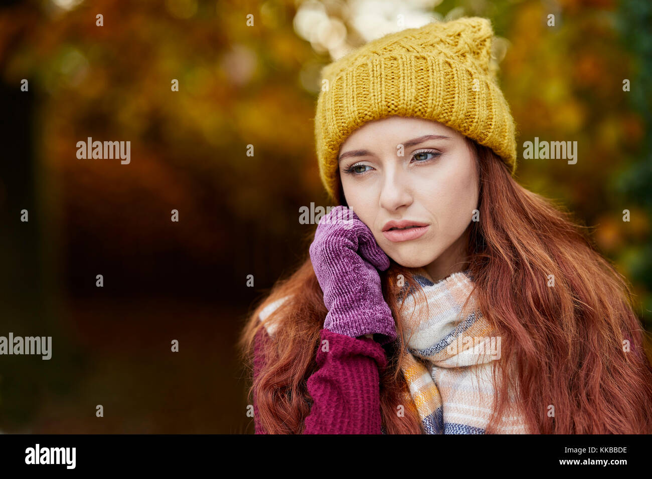 Girl looking concerned outdoors Stock Photo - Alamy
