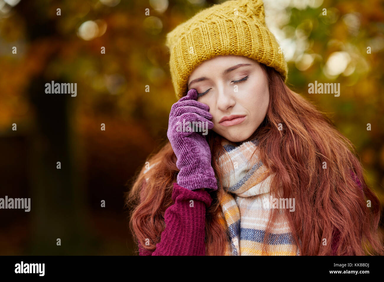 Girl looking concerned outdoors Stock Photo - Alamy