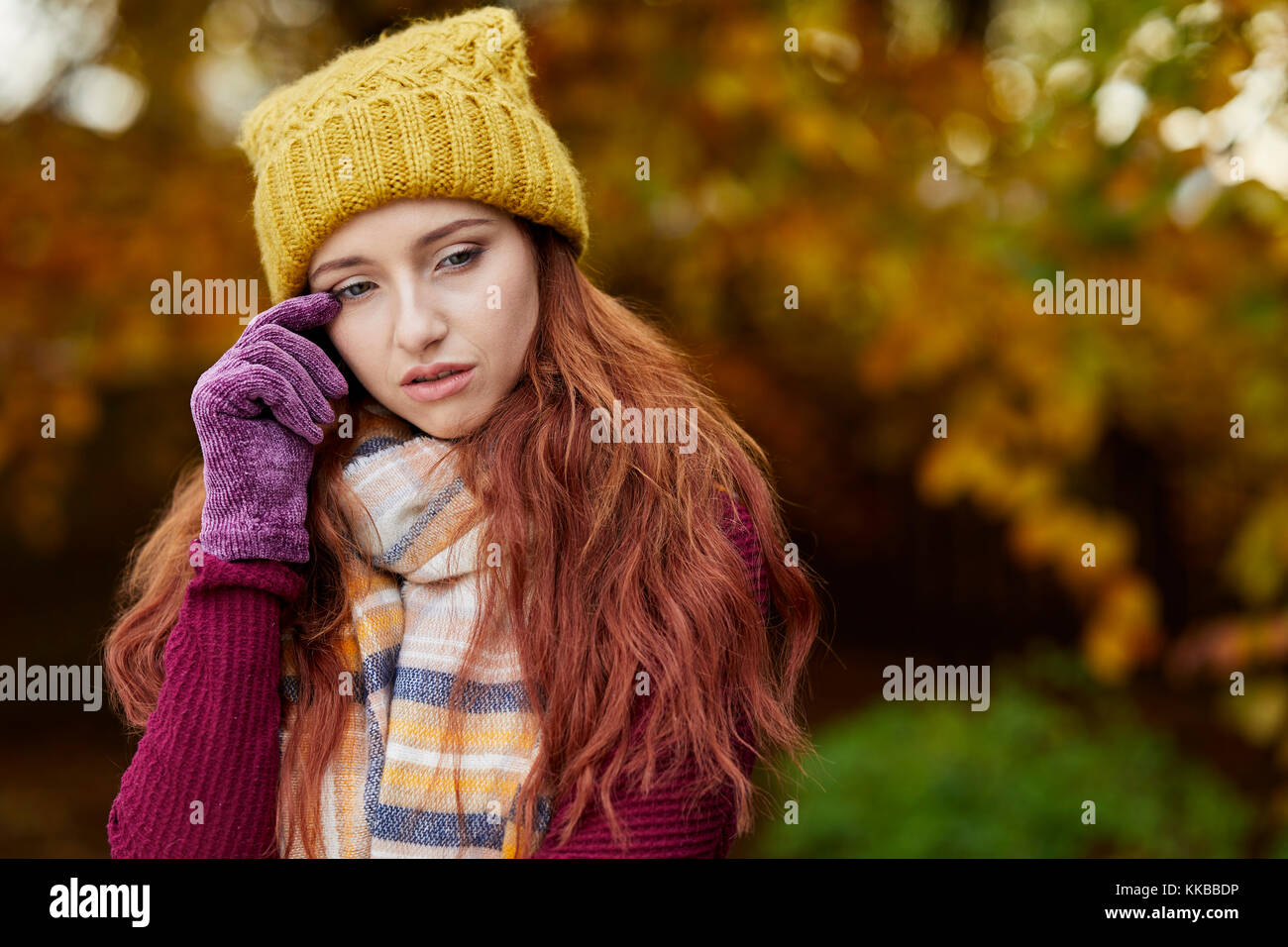 Girl looking concerned outdoors Stock Photo - Alamy