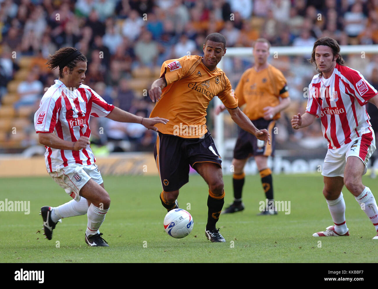Footballer Karl Henry takes on Darel Russell (left) and Carl Hoefkens ...