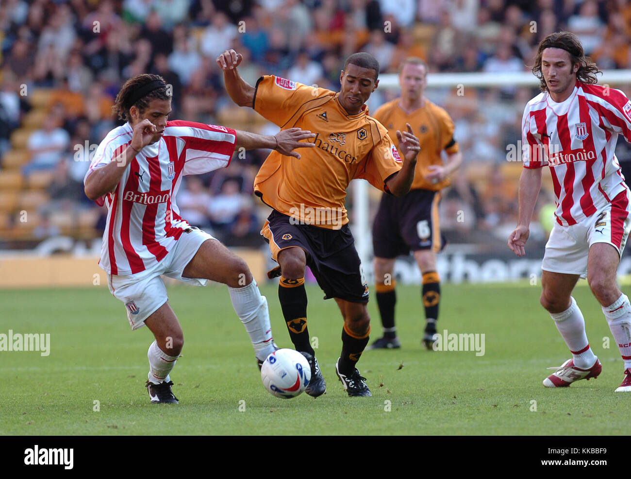 Footballer Karl Henry takes on Darel Russell (left) and Carl Hoefkens ...
