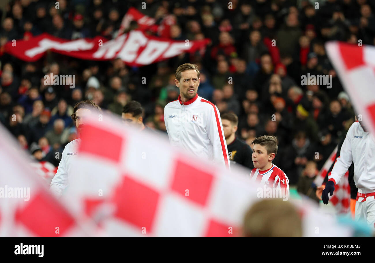 Stoke City's Peter Crouch walks onto the pitch with mascots during the ...