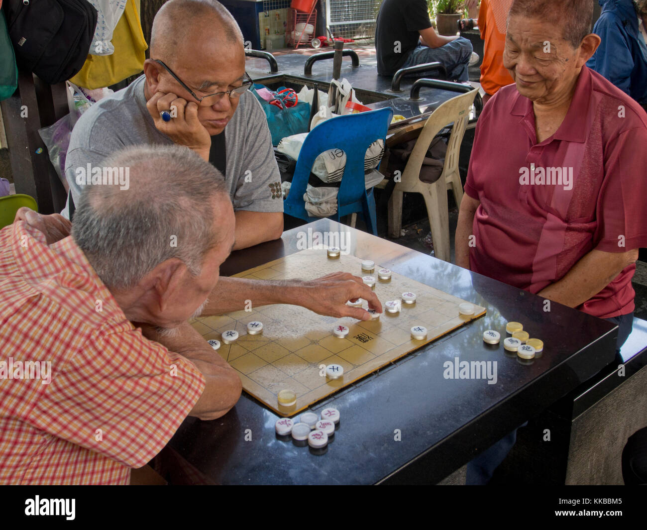 Senior citizens playing board games in Singapore Stock Photo - Alamy