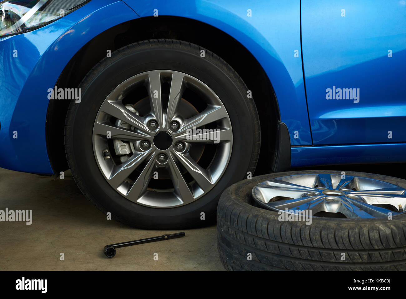 Car wheel install service. Damaged car wheel in bad road Stock Photo ...