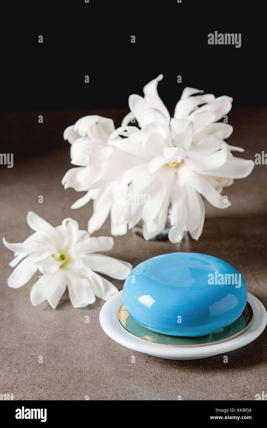 Fashionable mousse cake with a mirror glaze decorated with spring ...