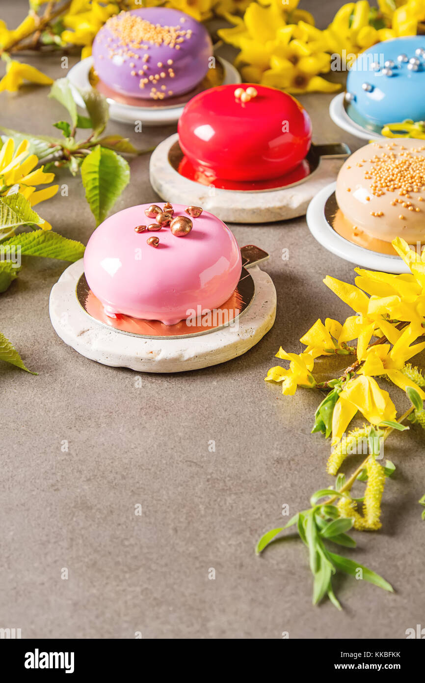 Fashionable mousse cake with a mirror glaze decorated with spring ...