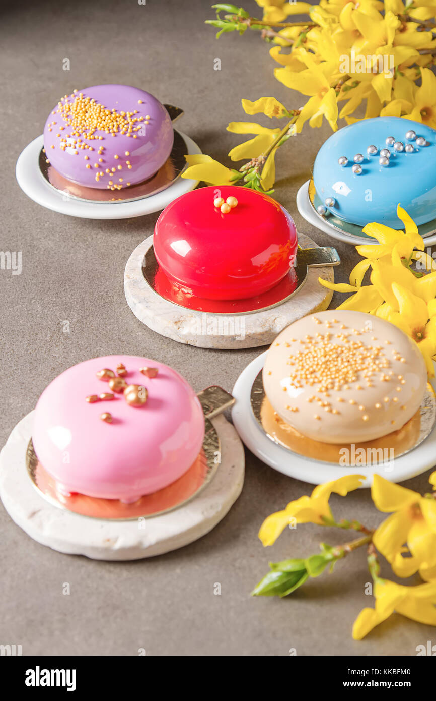 Fashionable mousse cake with a mirror glaze decorated with spring ...