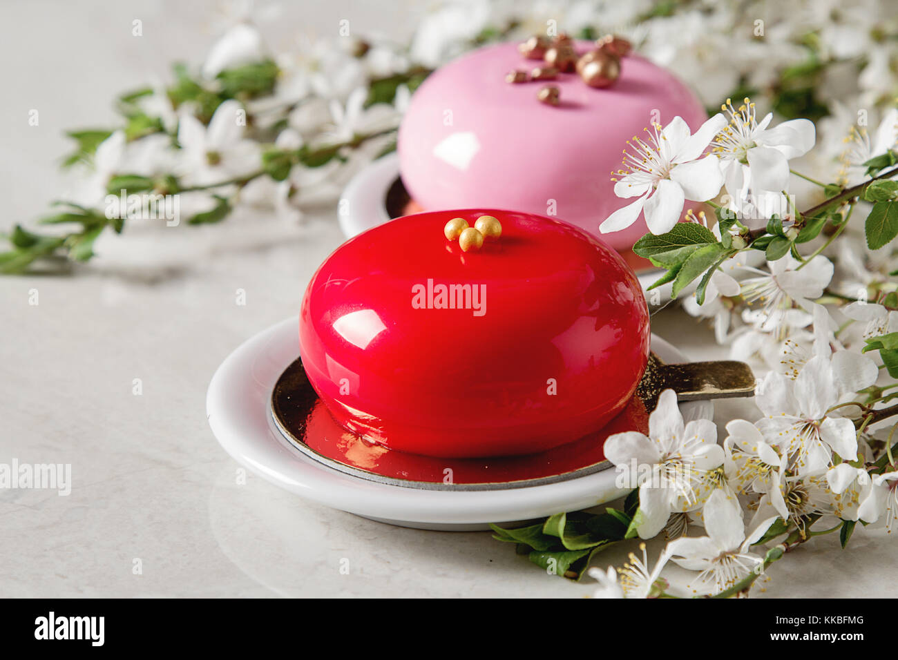 Fashionable mousse cake with a mirror glaze decorated with spring ...