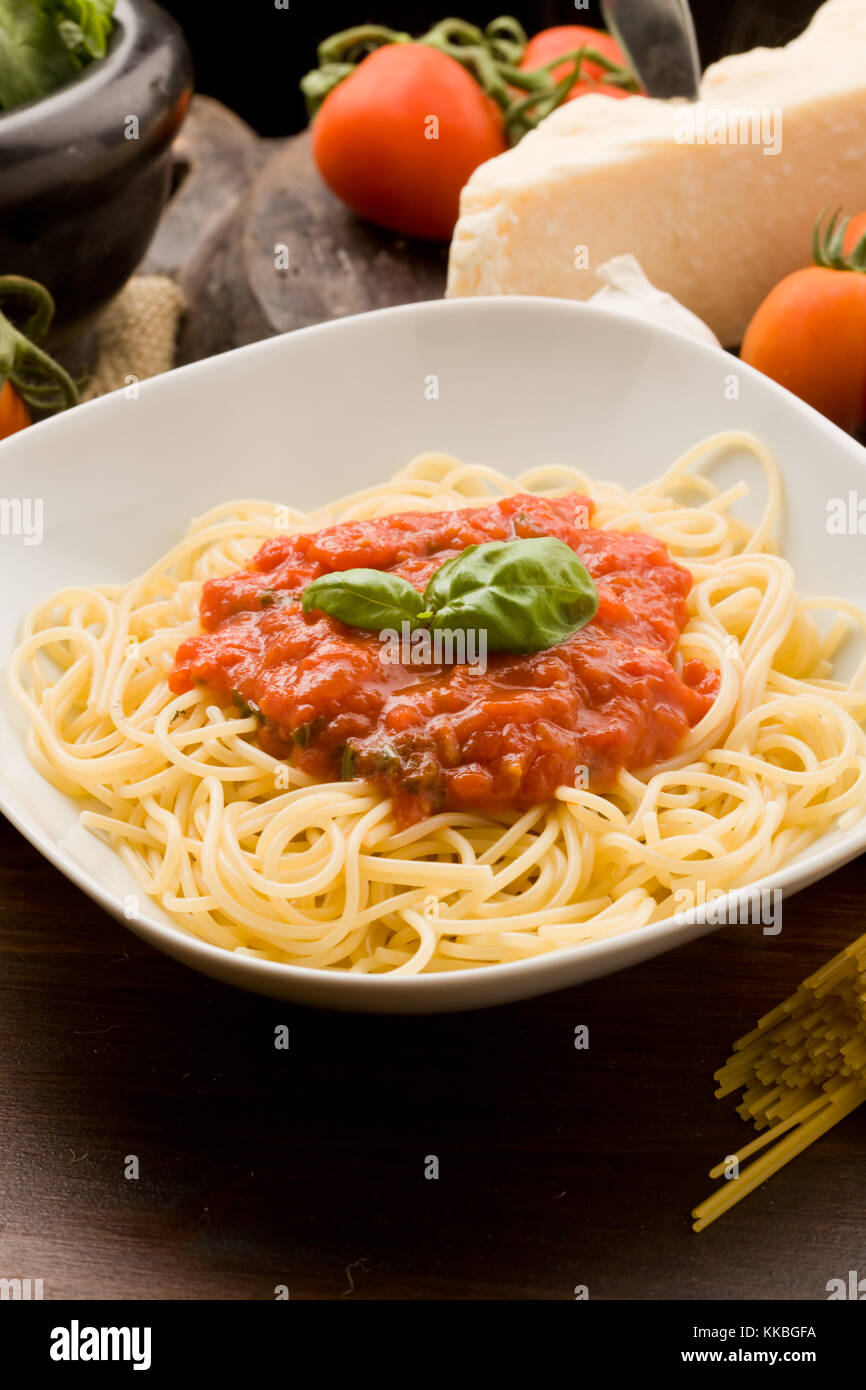 photo of italian spaghetti with tomatoe sauce and their ingredients ...