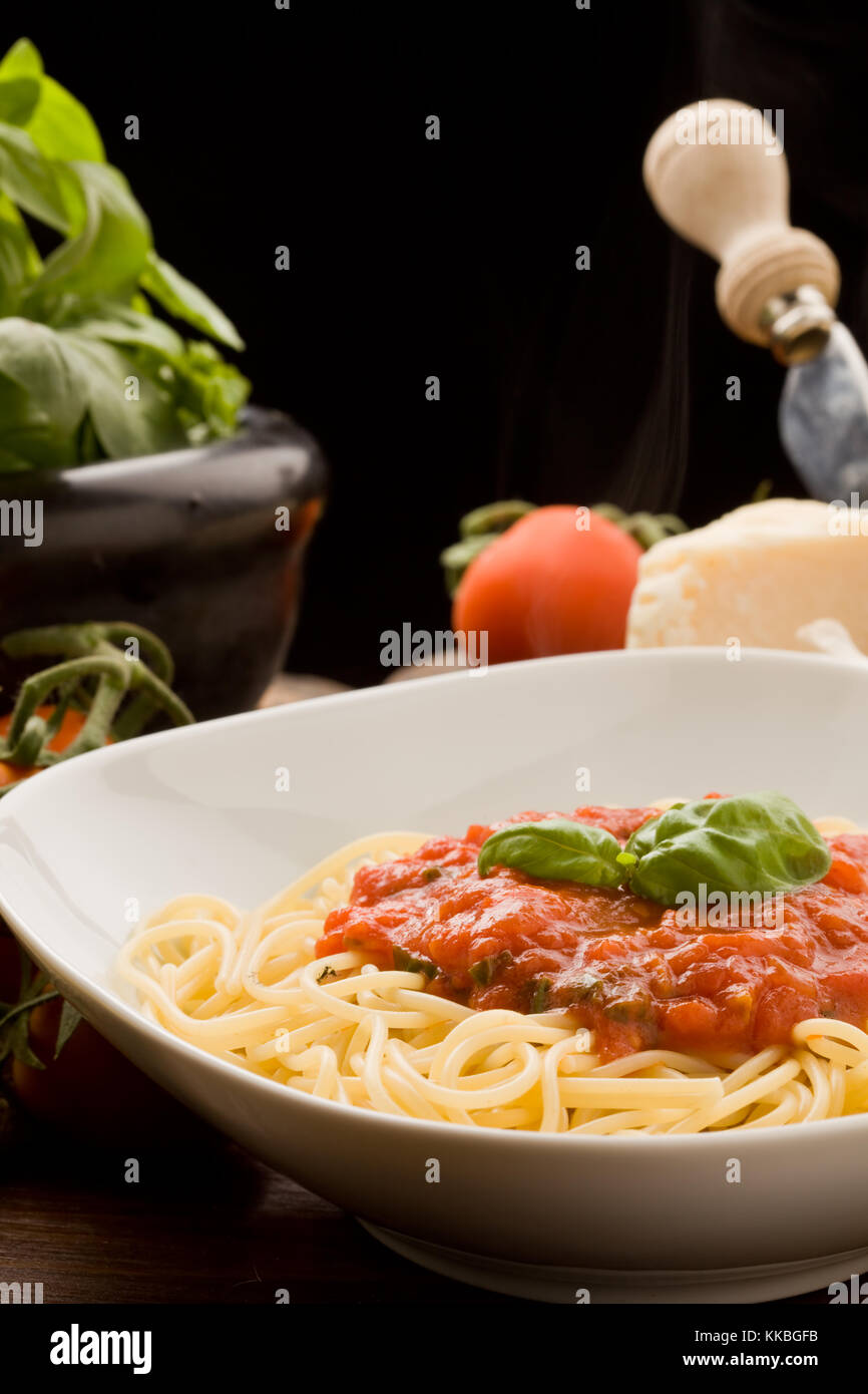 photo of italian spaghetti with tomatoe sauce and their ingredients ...