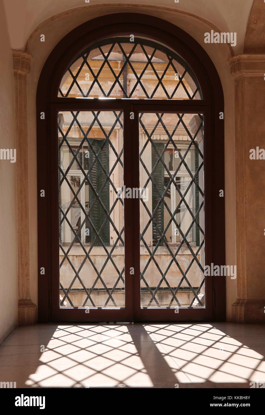 ray of sunshine coming from the old window of an ancient Italian palace ...