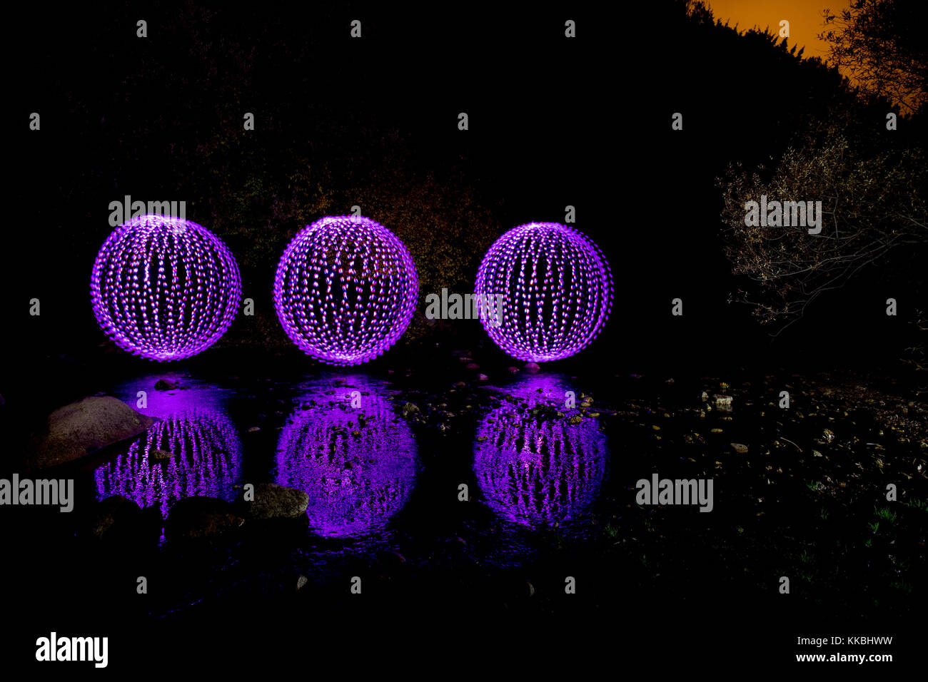 Spheres of light made on water to capture their own reflection with ...