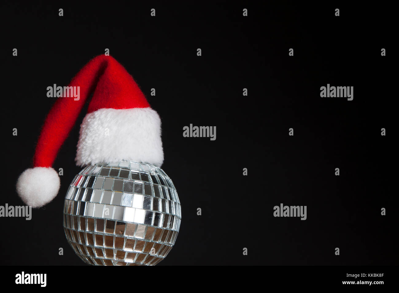Christmas party background. Santa hat with disco mirrorball Stock Photo ...