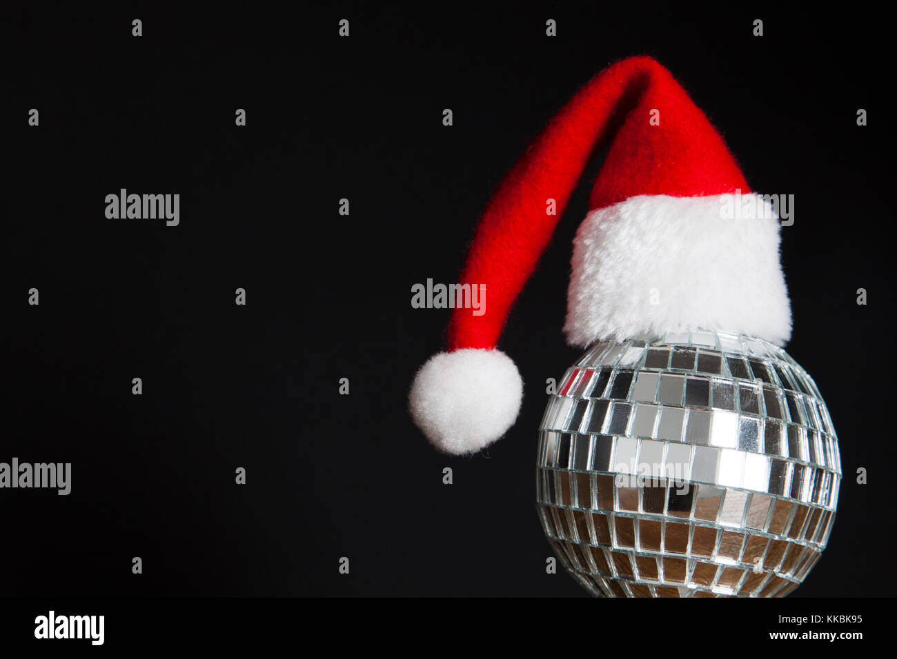 Christmas party background. Santa hat with disco mirrorball Stock Photo ...