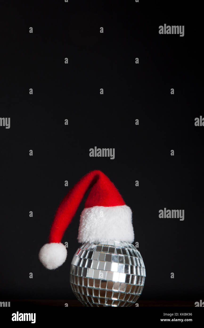 Christmas party background. Santa hat with disco mirrorball Stock Photo ...