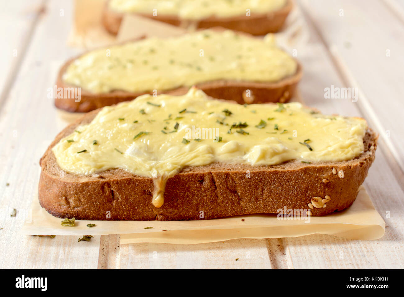 Melted cheese sandwich on the table.Selective focus on the front ...
