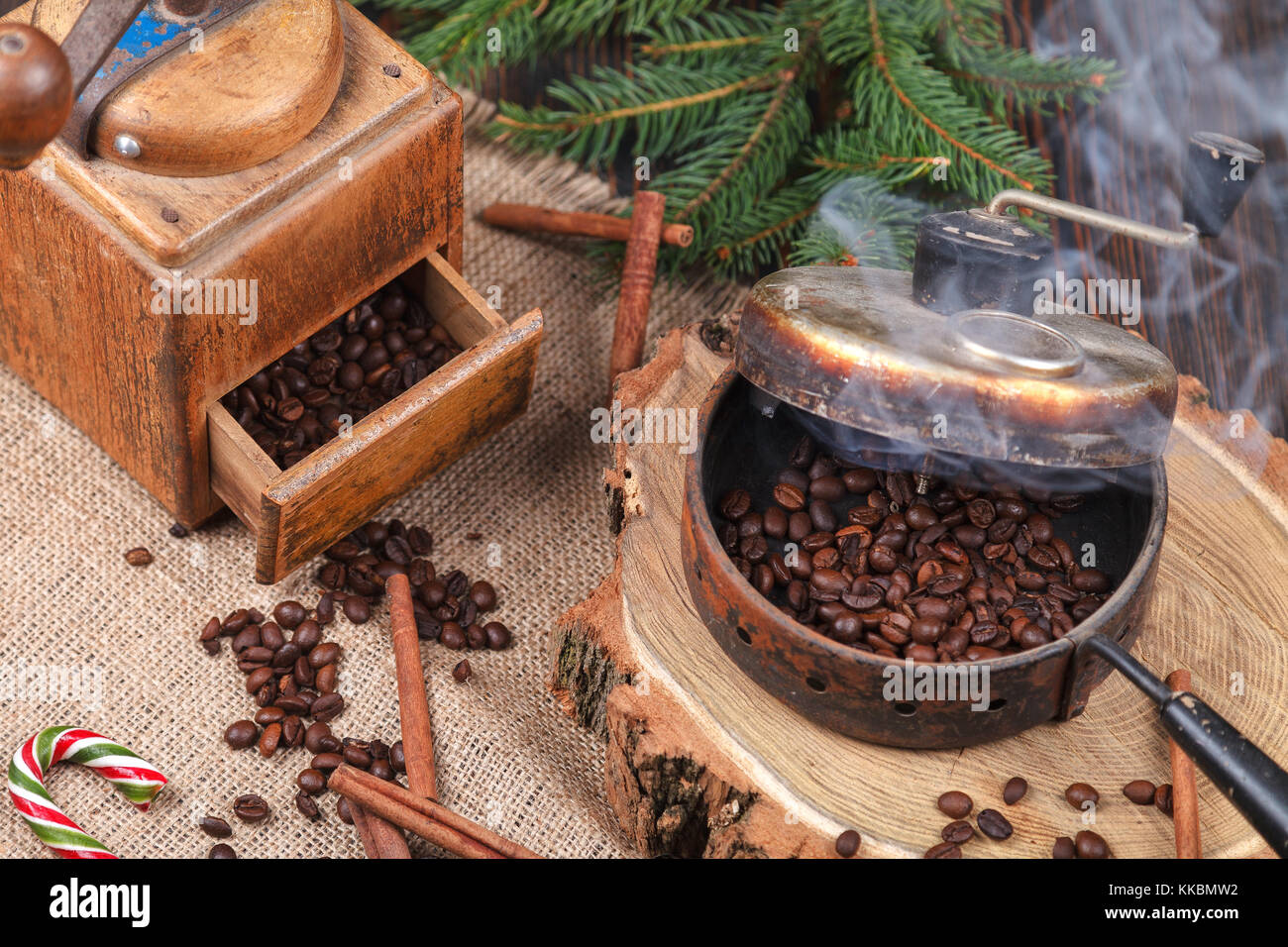 The device for roasting coffee beans, an old hand grinder. Smoky roast ...
