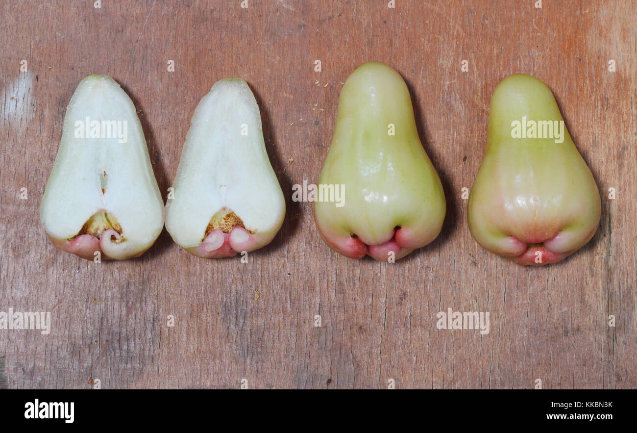 green rose apple slice on wooden board Stock Photo - Alamy