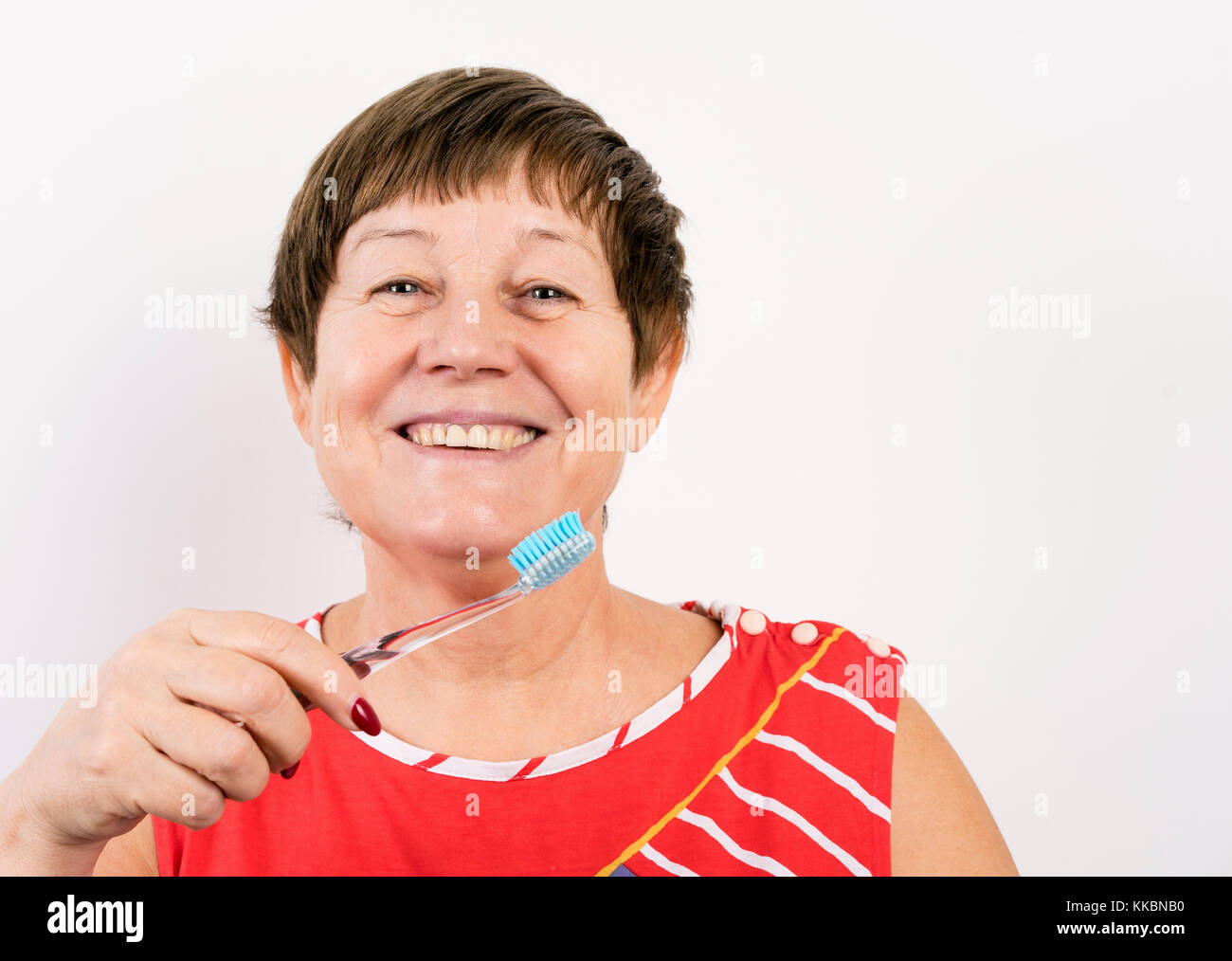 grandma brushing her teeth with a brush Stock Photo - Alamy
