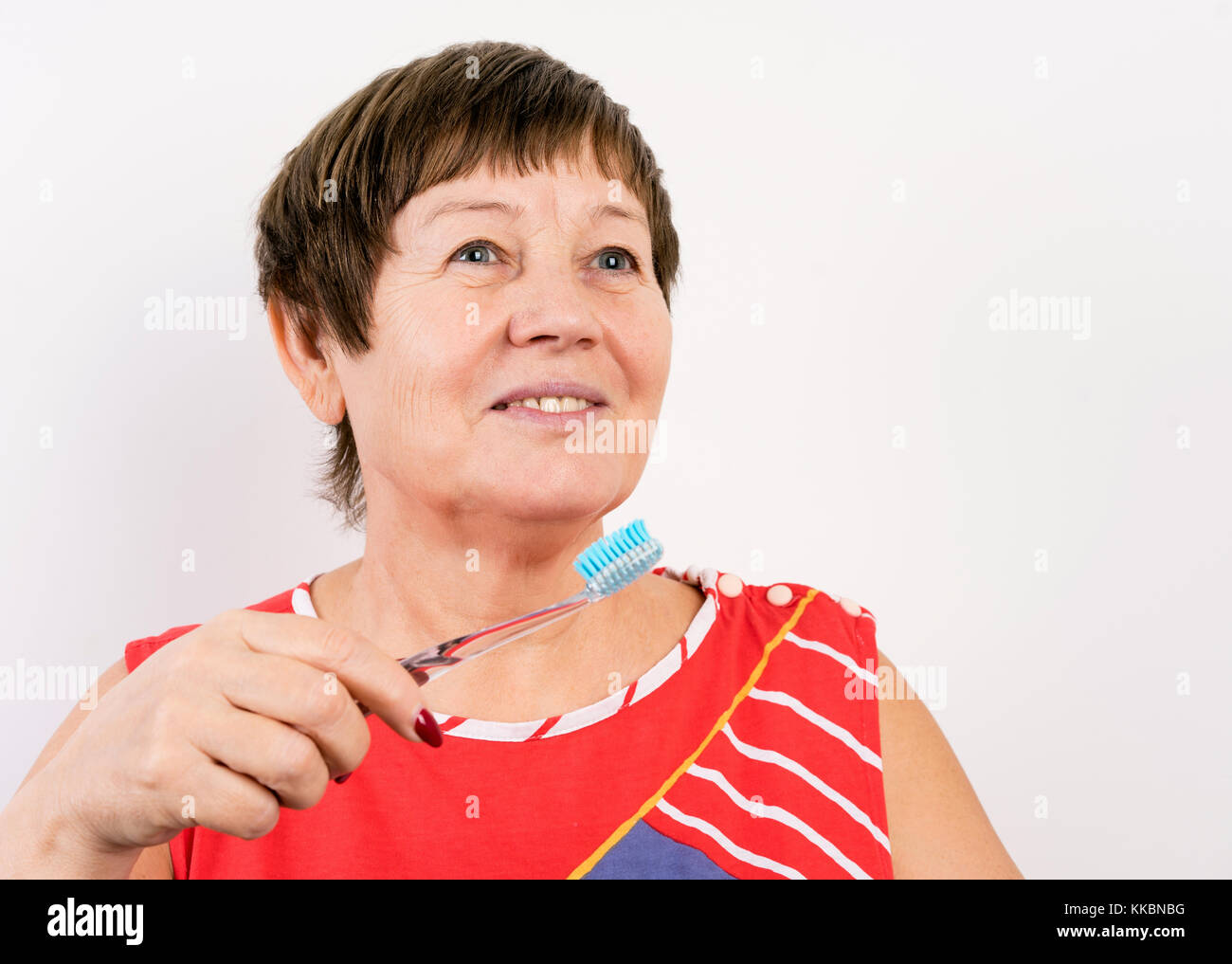 grandma brushing her teeth with a brush Stock Photo - Alamy