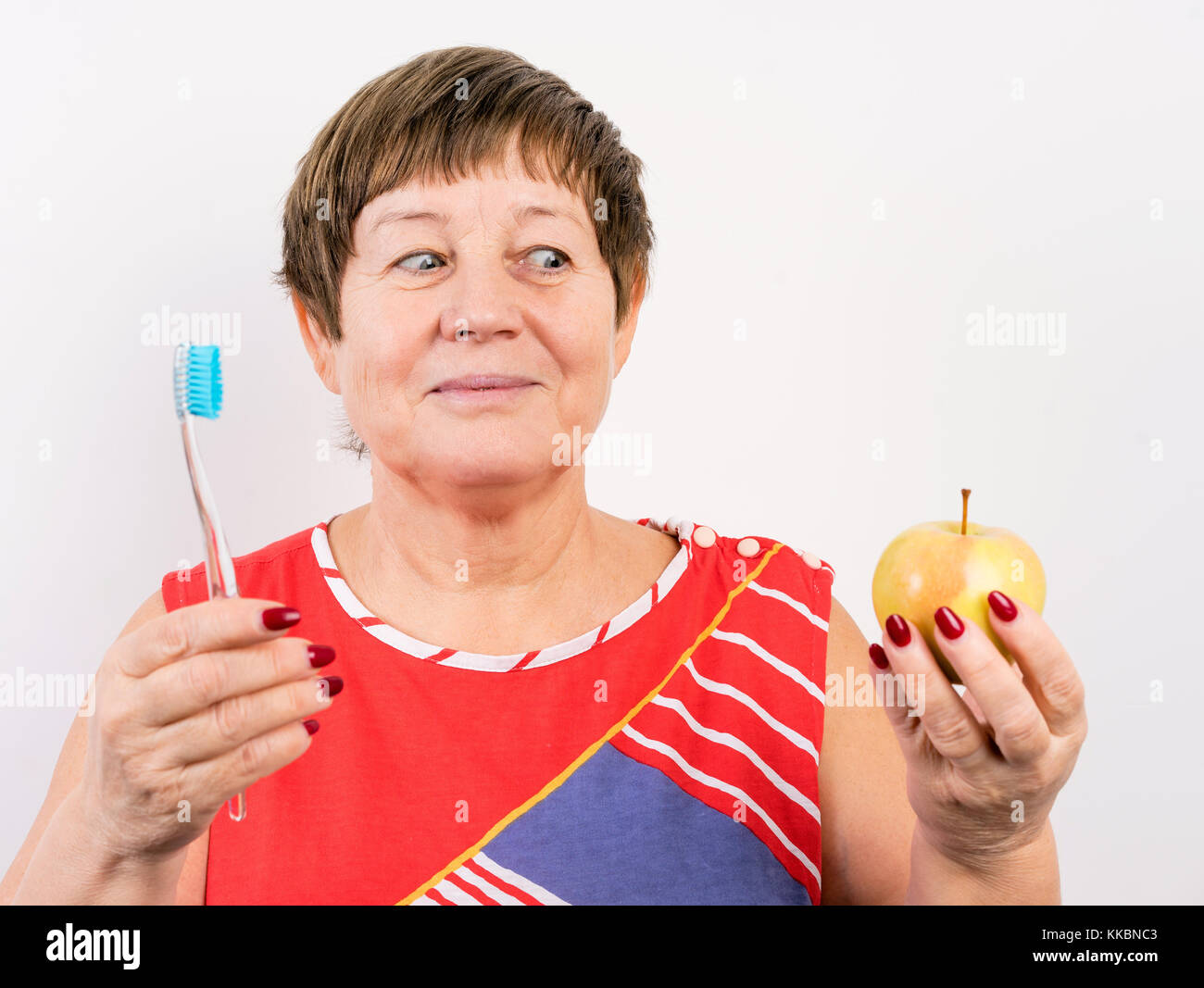 grandma brushing her teeth with a brush Stock Photo - Alamy