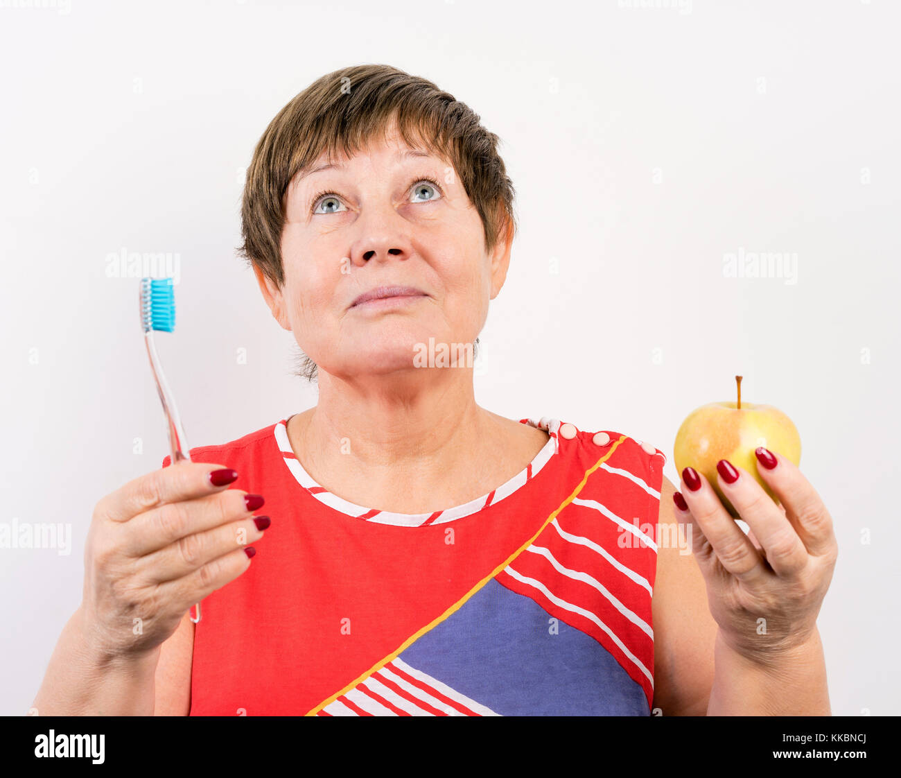 grandma brushing her teeth with a brush Stock Photo - Alamy