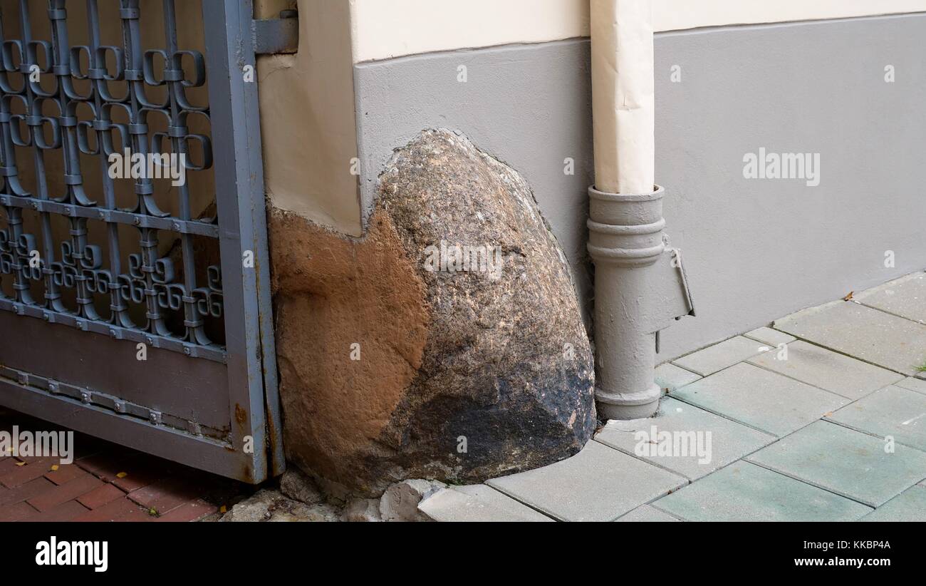 Rock built into wall Stock Photo - Alamy