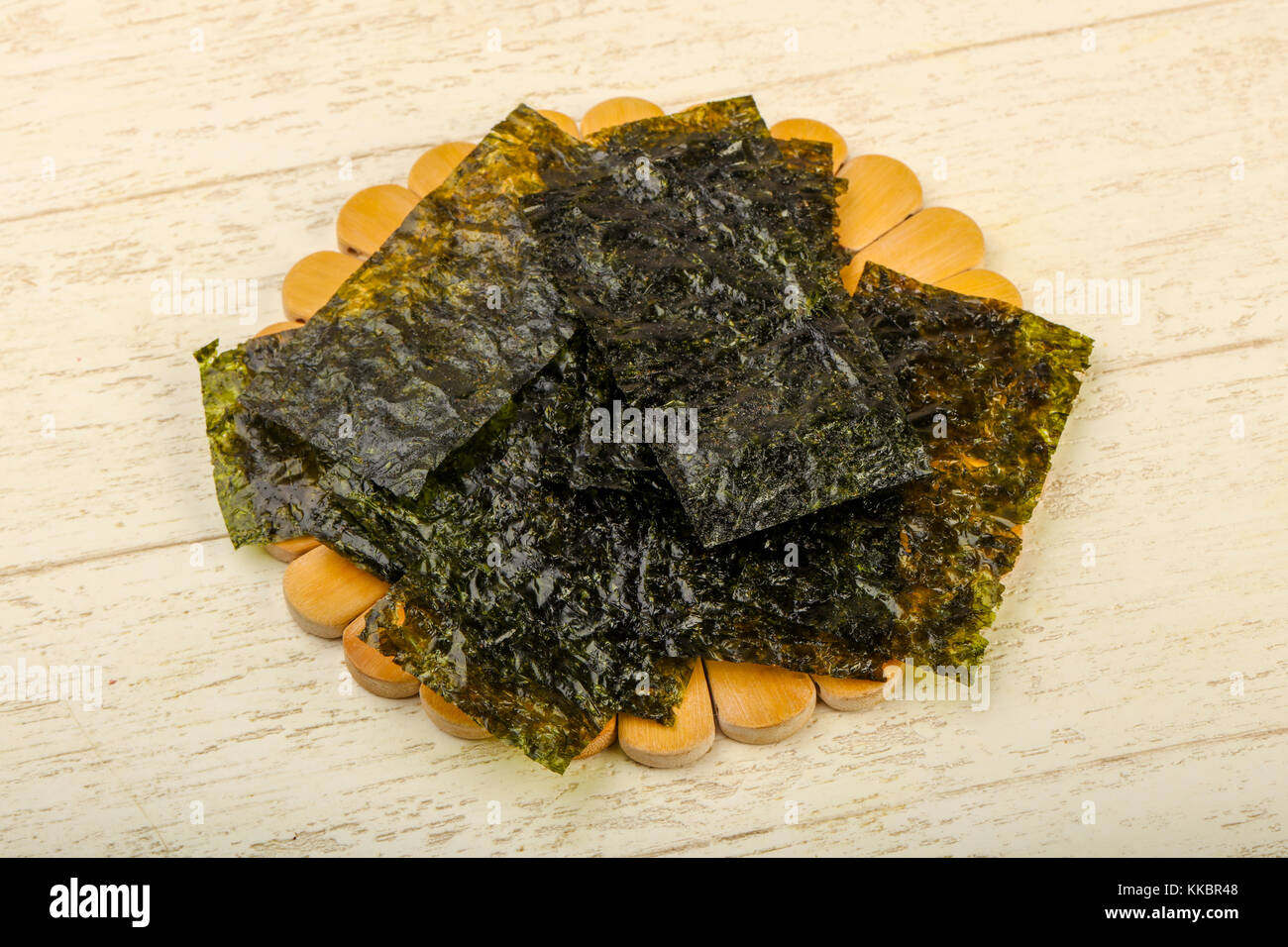 Crispy Nori sheets chips over wooden background Stock Photo - Alamy