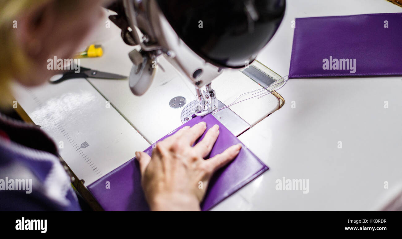 woman stitching a purse Stock Photo - Alamy