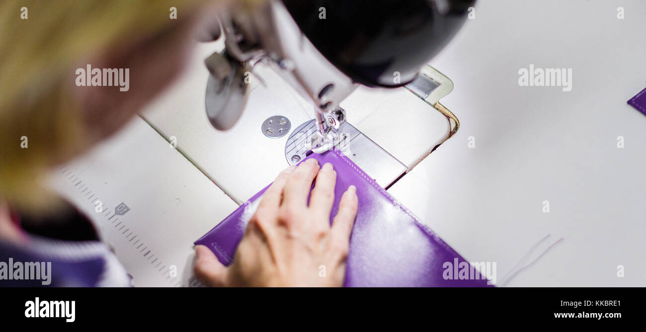 woman stitching a purse Stock Photo - Alamy