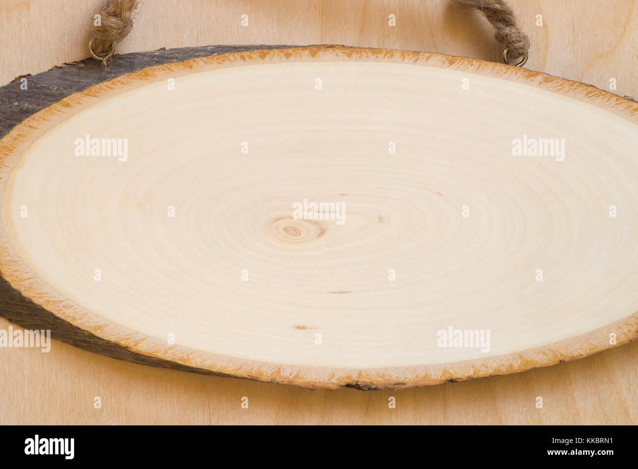 beige wooden oval shape on wood background Stock Photo - Alamy