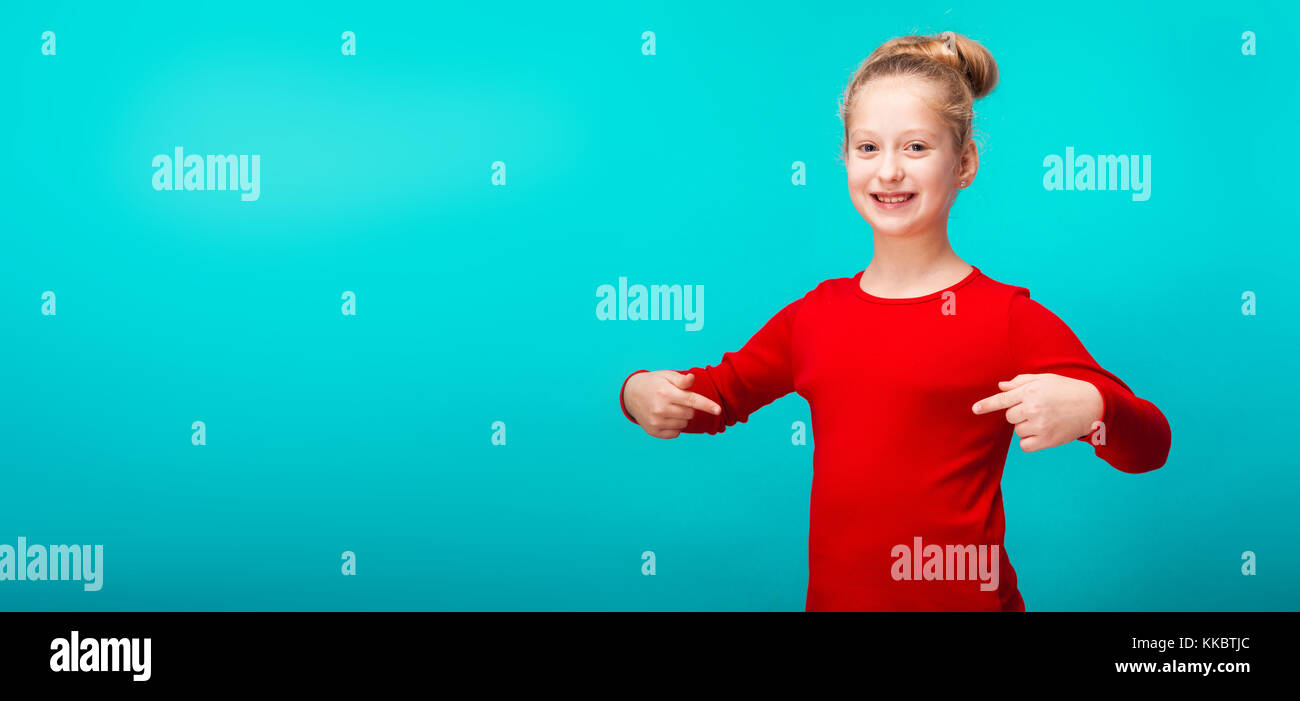 smiling little girl on blue background Stock Photo - Alamy