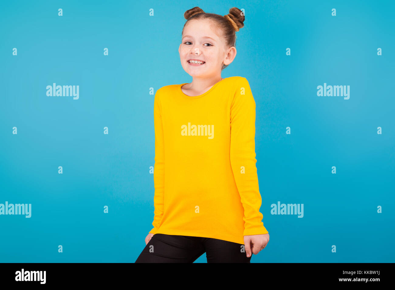 cute little girl in yellow pullover Stock Photo - Alamy