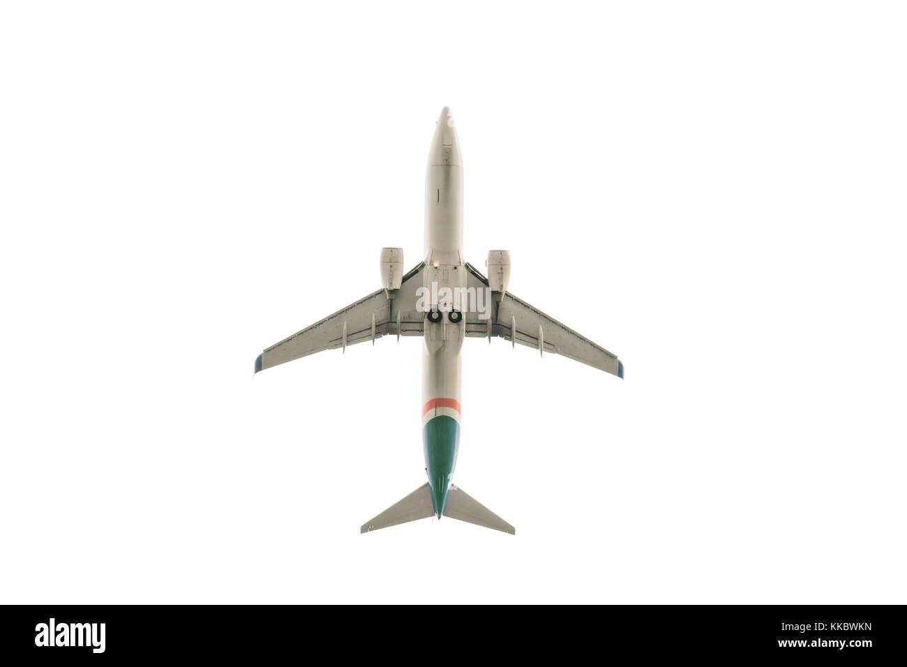 Large flying airplane view from below, isolated on white background ...