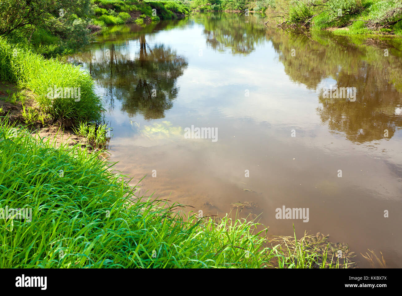 spring rural landscape with reflection in river Stock Photo - Alamy
