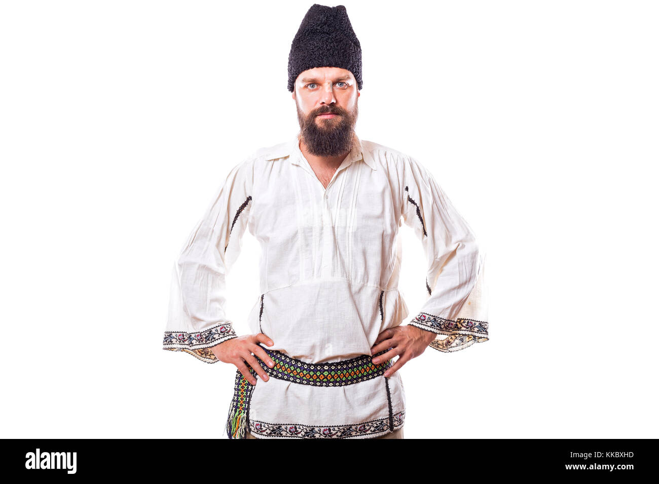 young man wearing traditional romanian costume on white background ...