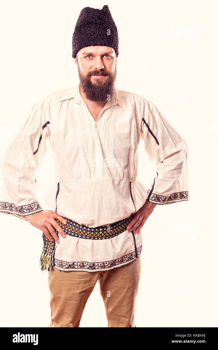 young man wearing traditional romanian costume on white background ...