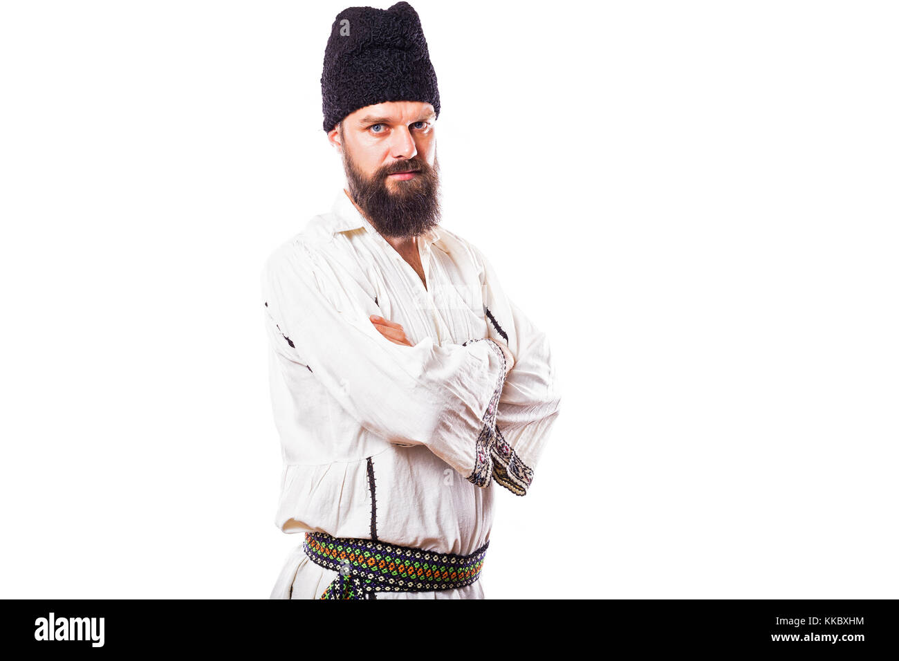 young man wearing traditional romanian costume on white background ...