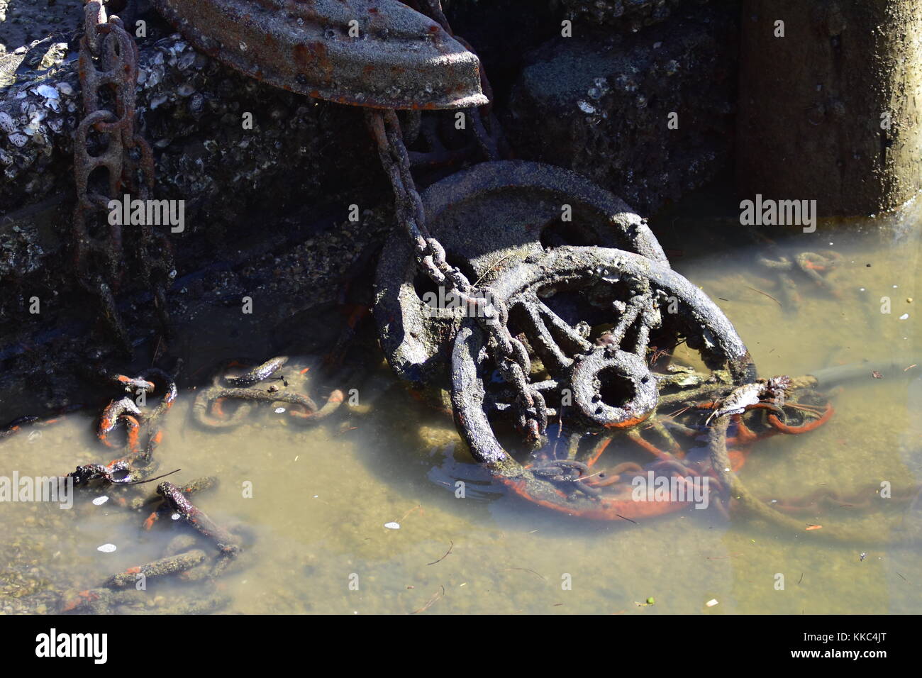 Rusty pieces of cast iron chined together to serve as mooring ballast ...