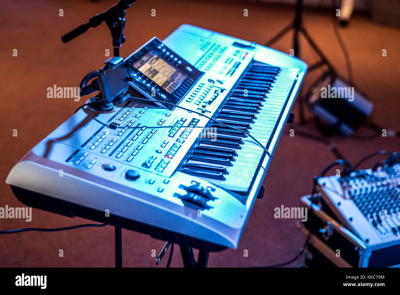 Classical electronical music keyboard view in blue concert lights bokeh ...