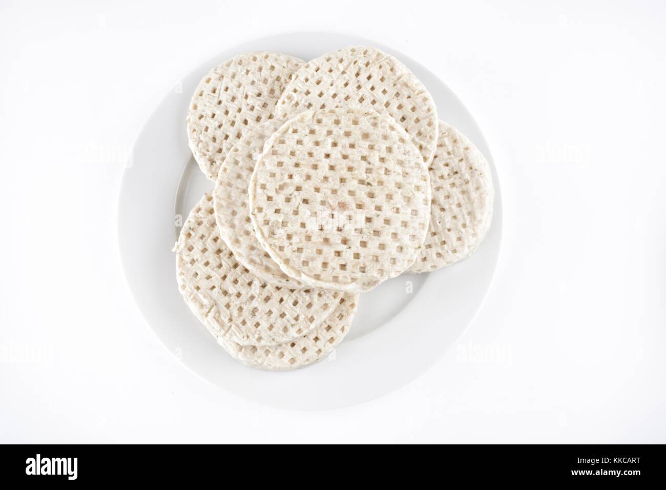 Frozen raw chicken meat over white background Stock Photo - Alamy