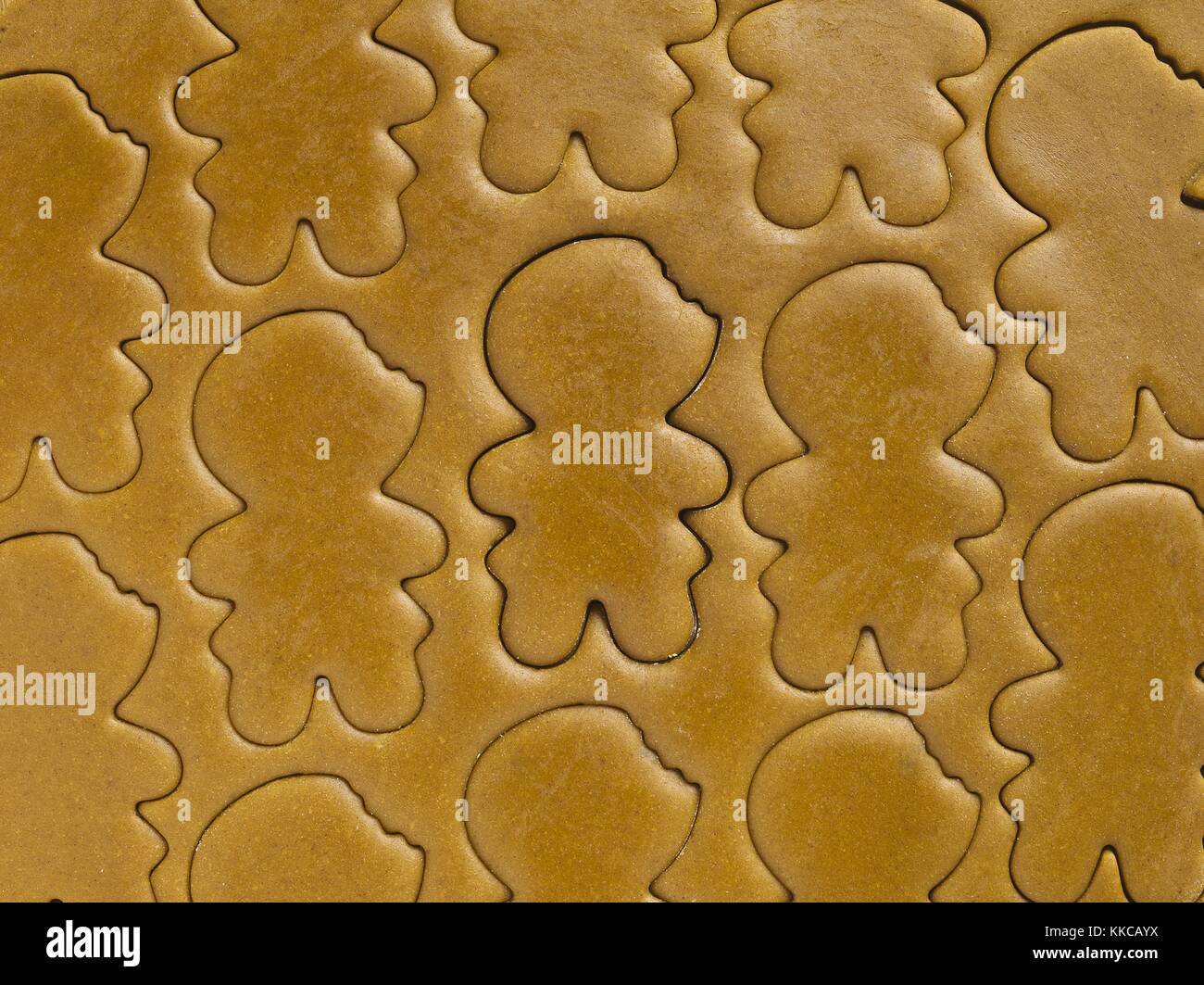 image of gingerbread man shapes on dough Stock Photo - Alamy