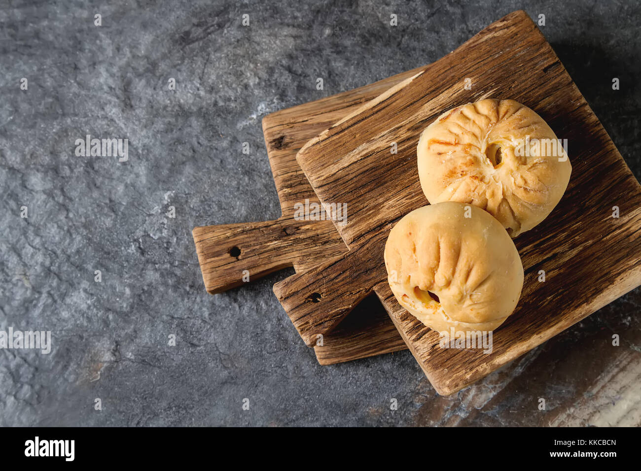 Traditional Russian meat pie, (belyashi). Dark background Stock Photo ...